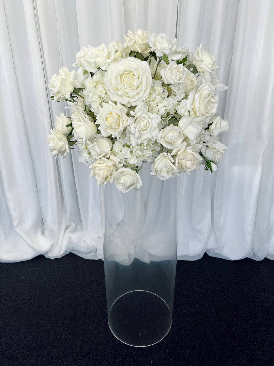 Clear round cylinder plinth with Eve floral – Fairytale Events Pty Ltd